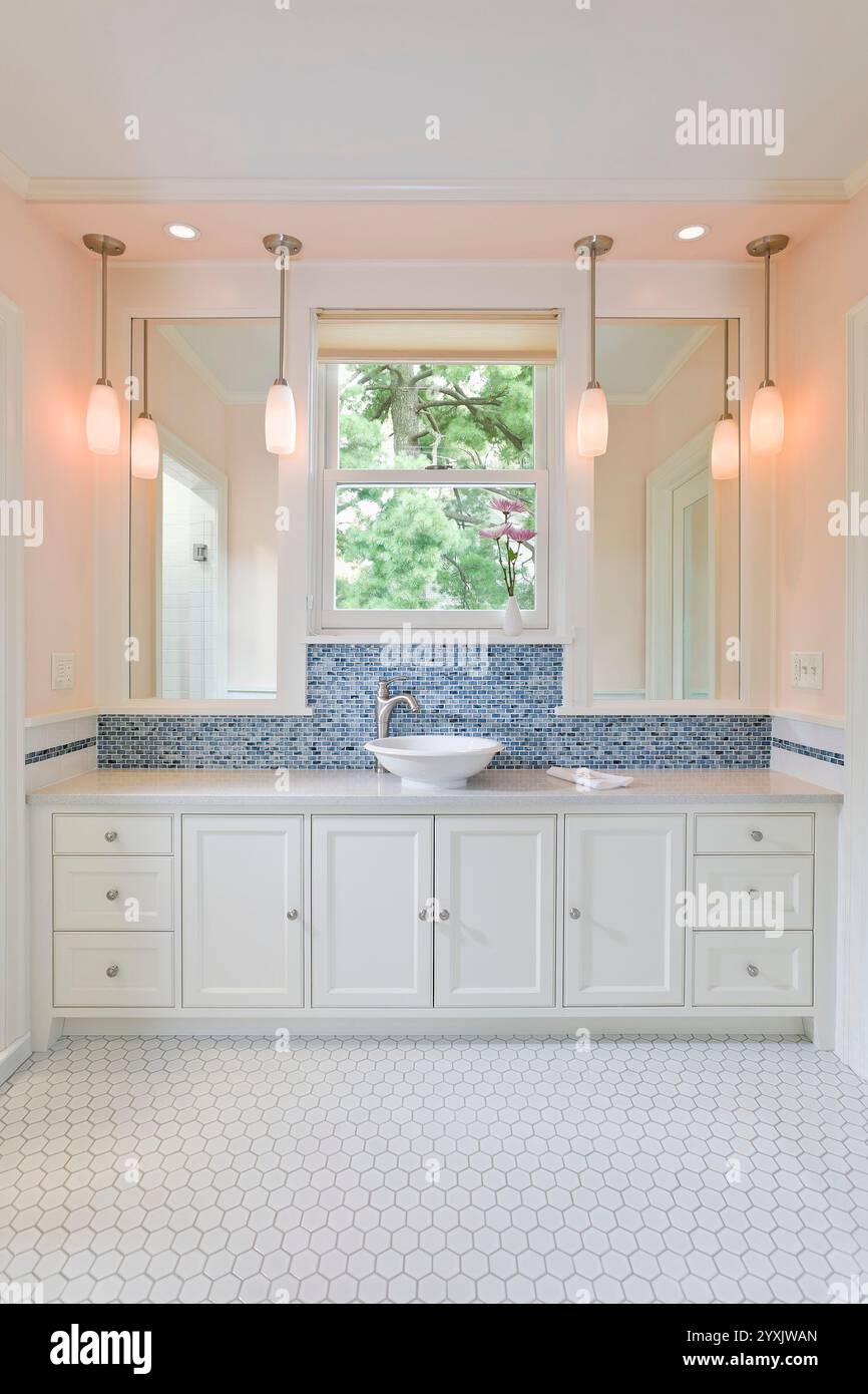Pretty feminine bathroom with pink walls and blue mini-tile backsplash ...