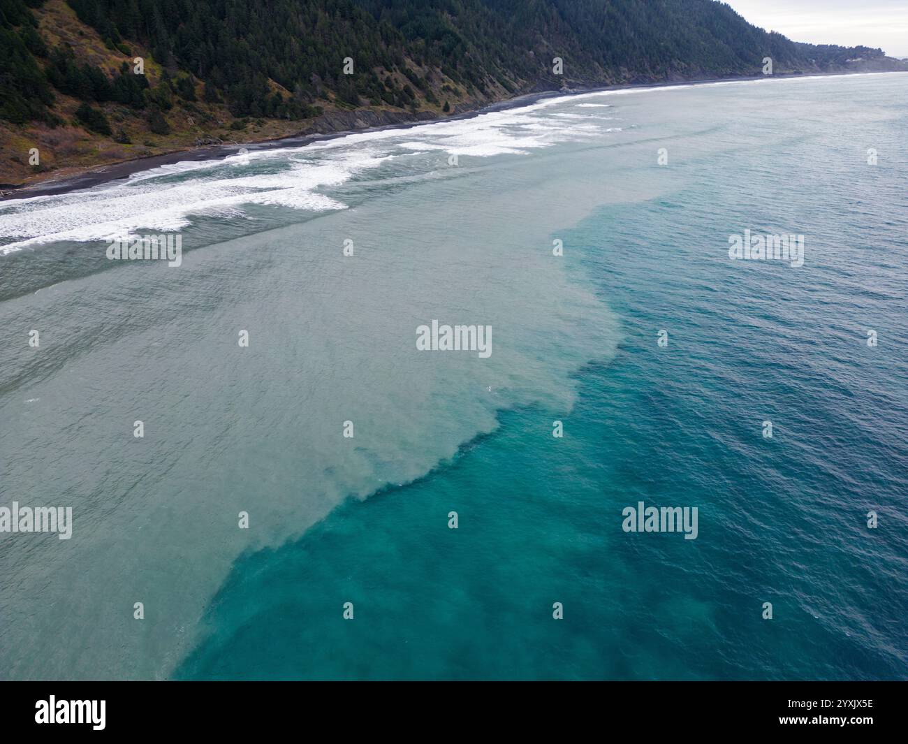 Aerial view of sediment plumes in the Pacific ocean off the coast of ...