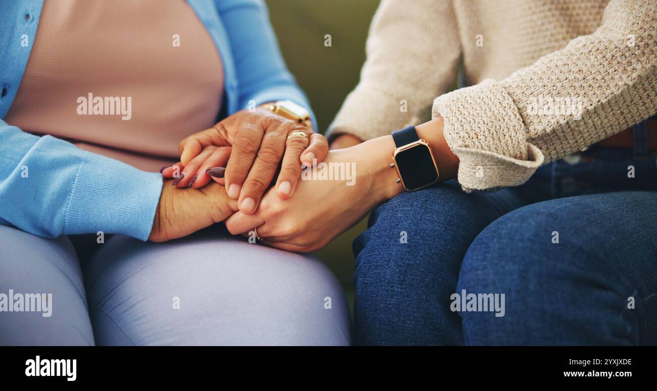 Senior woman, friend and holding hands for empathy in home with grief ...
