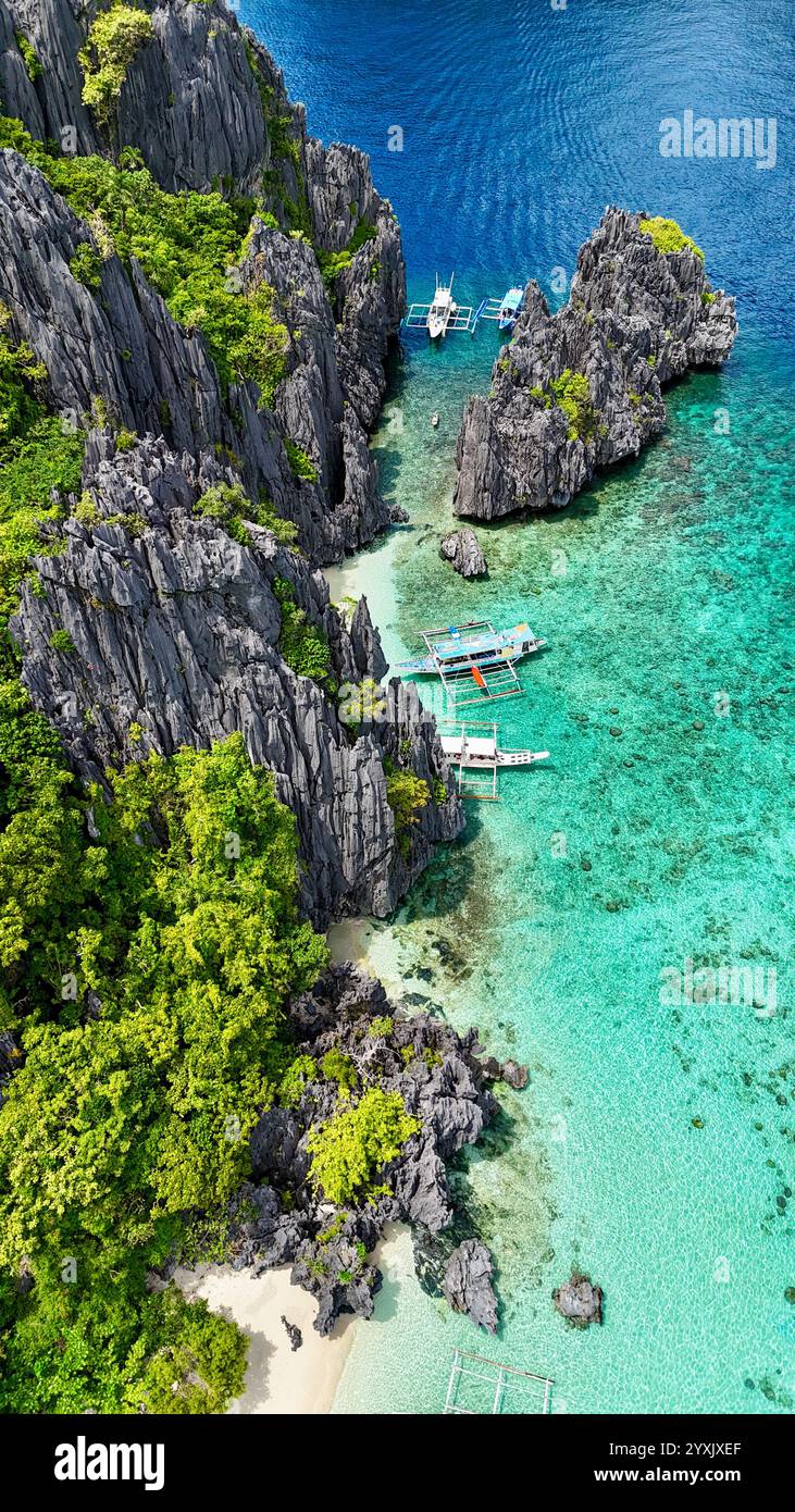 A breathtaking tropical lagoon surrounded by dramatic limestone cliffs ...