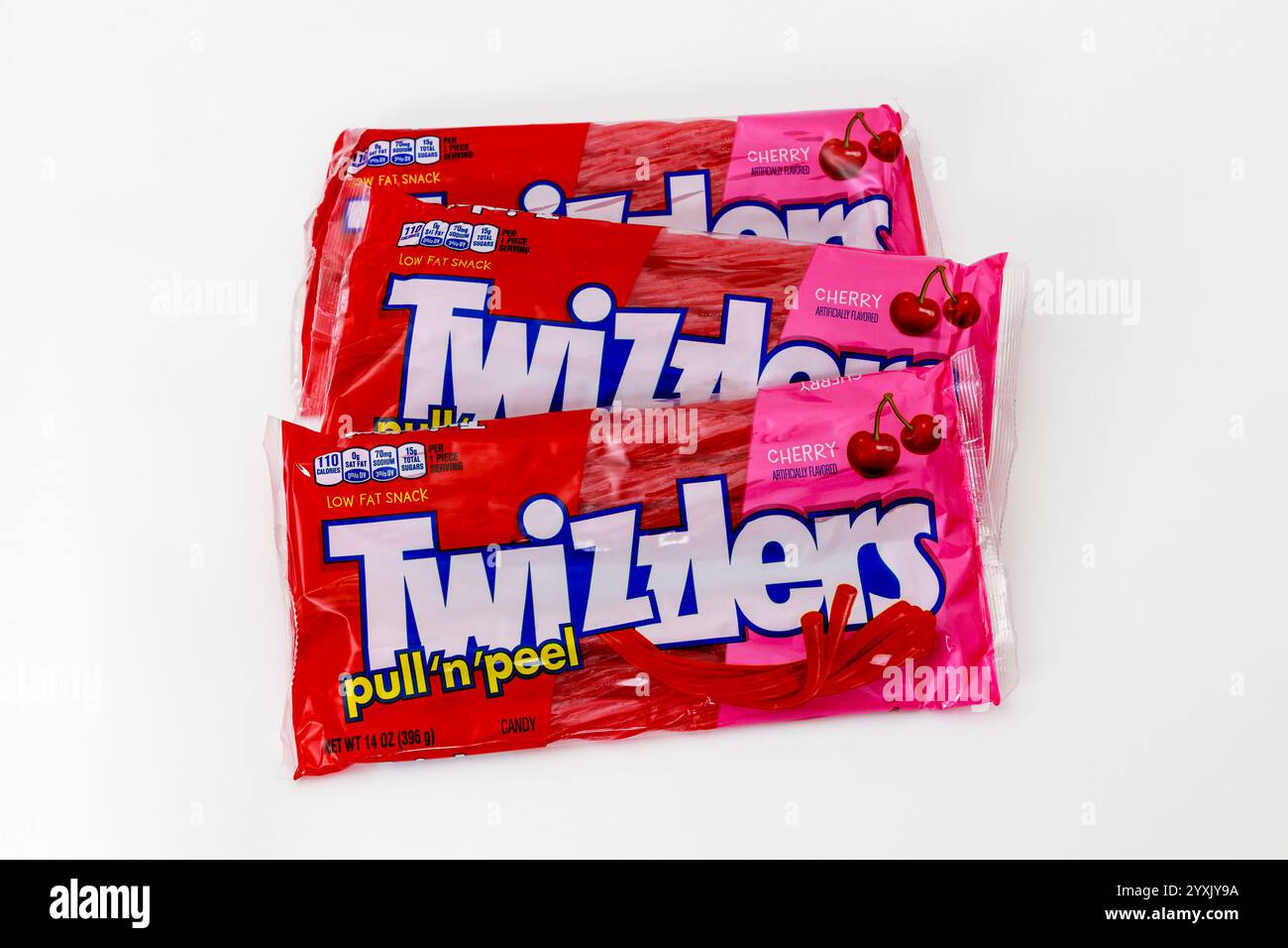 Enjoying cherry pull and peel candy at summer gathering with friends ...