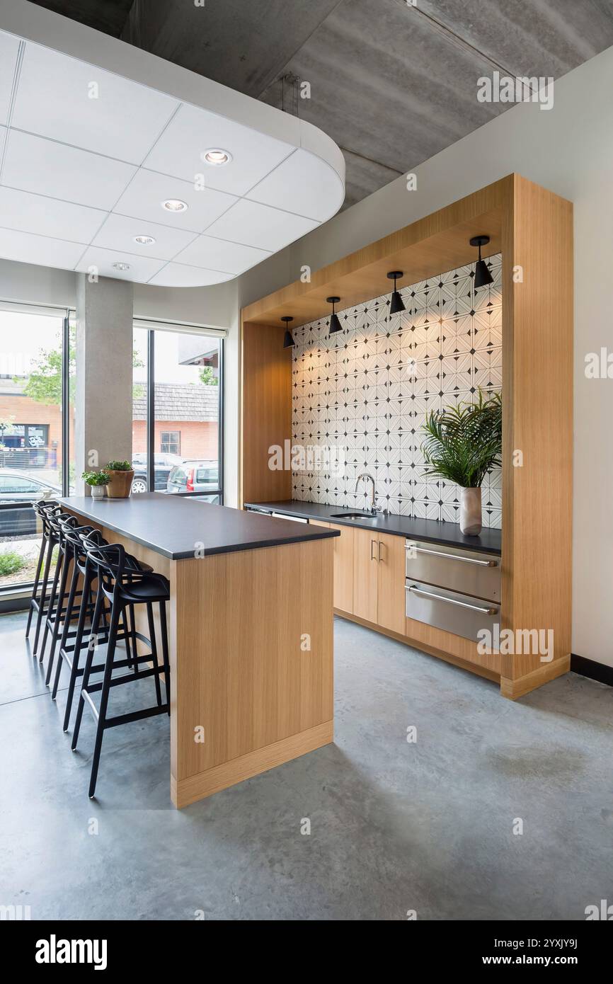 Kitchen is framed by rift sawn white oak wood enclosure hi-res stock ...