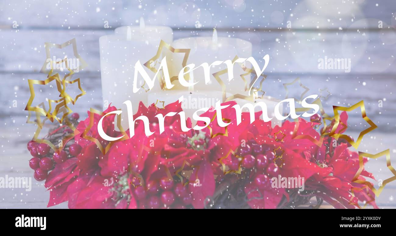 Candles burning behind bright Merry Christmas message. Red flowers and ...