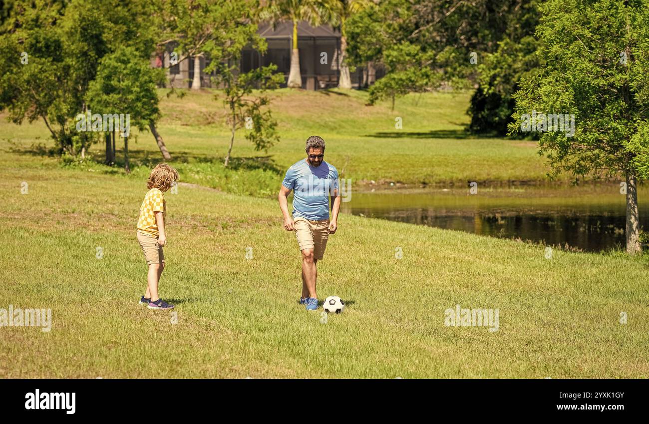 Father dad and son enjoying outdoor activities together. kicking soccer ...
