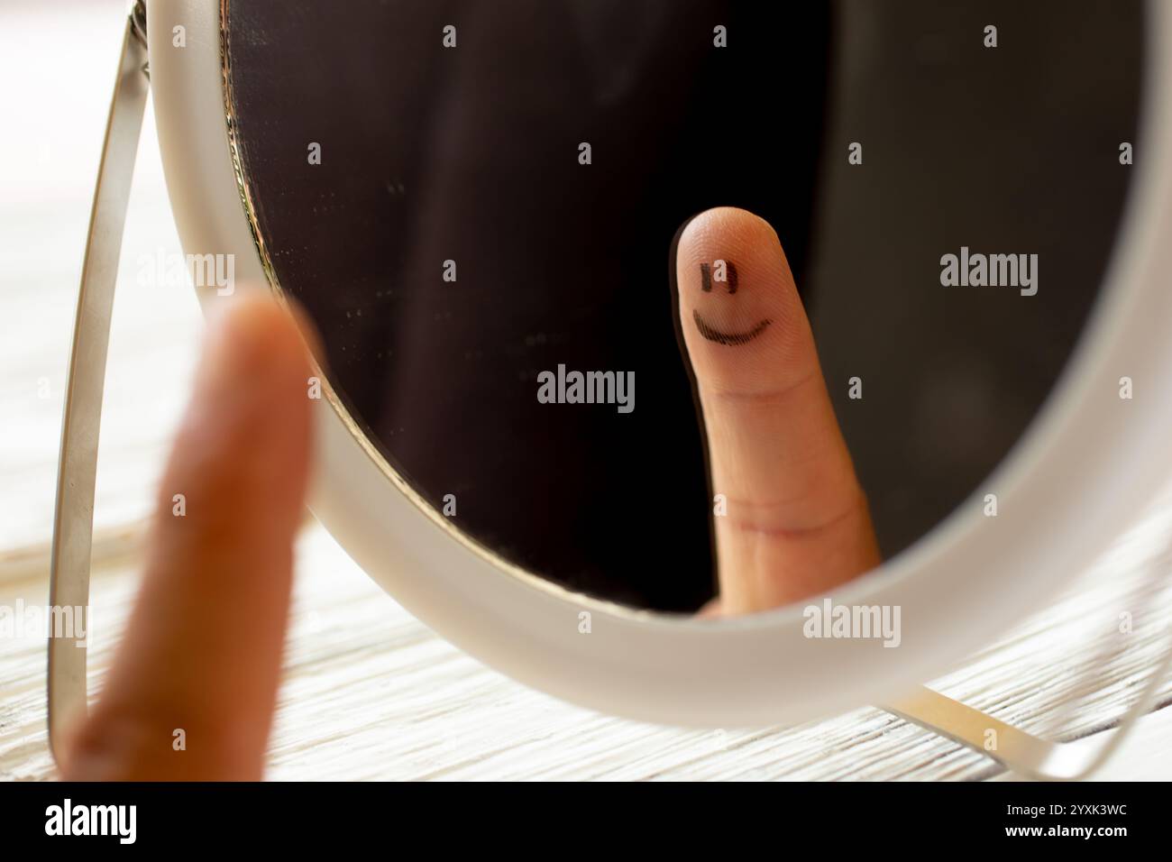 A view of a happy finger face looking at itself in the mirror Stock ...