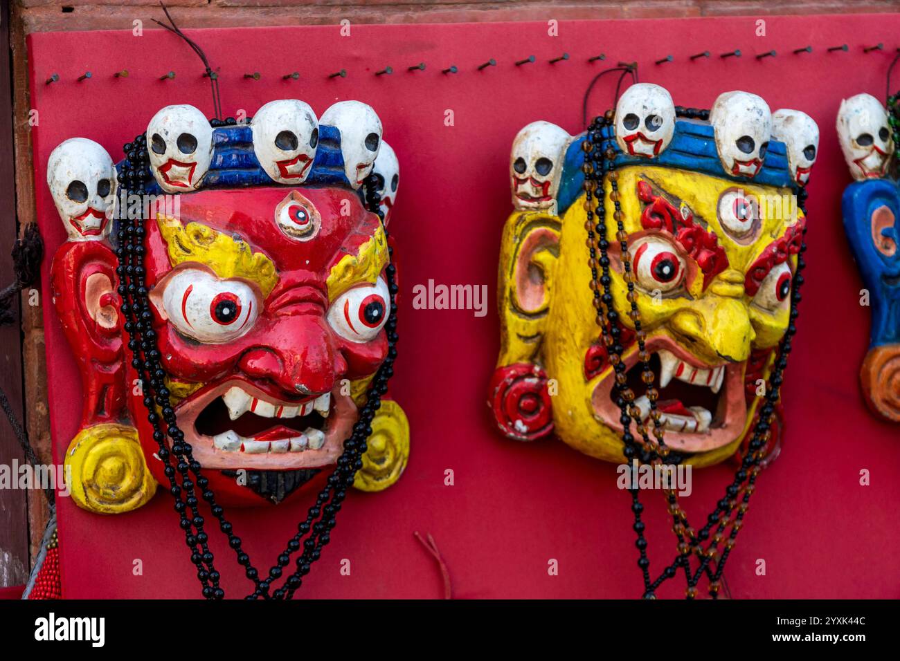Traditional wooden masks on sale at souvenir shop at Swayambhunath ...