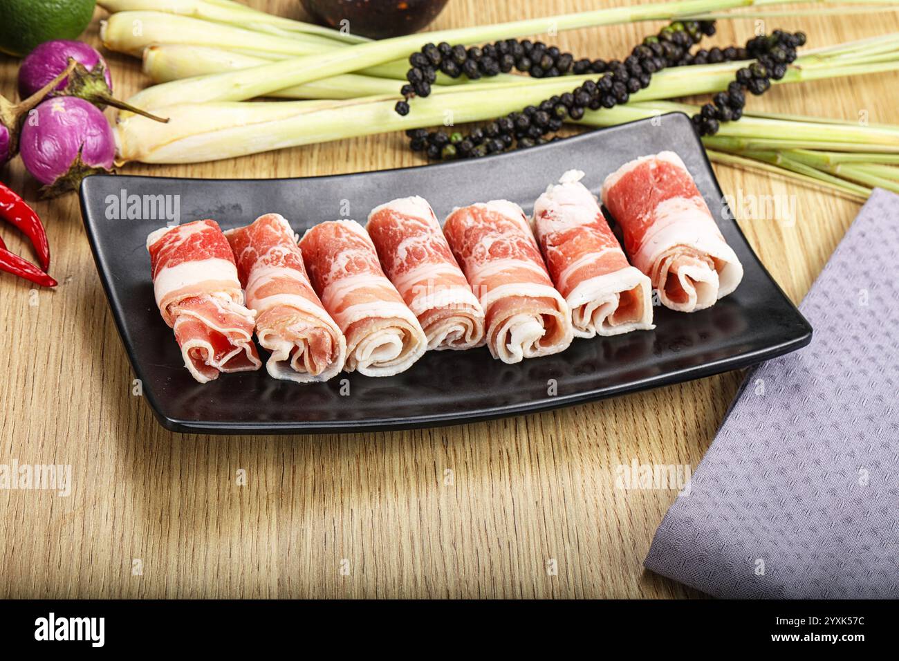 Raw beef bacon roll for grill Stock Photo - Alamy