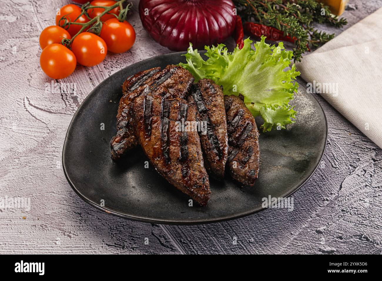 Grilled diet beef liver steak in the plate Stock Photo - Alamy
