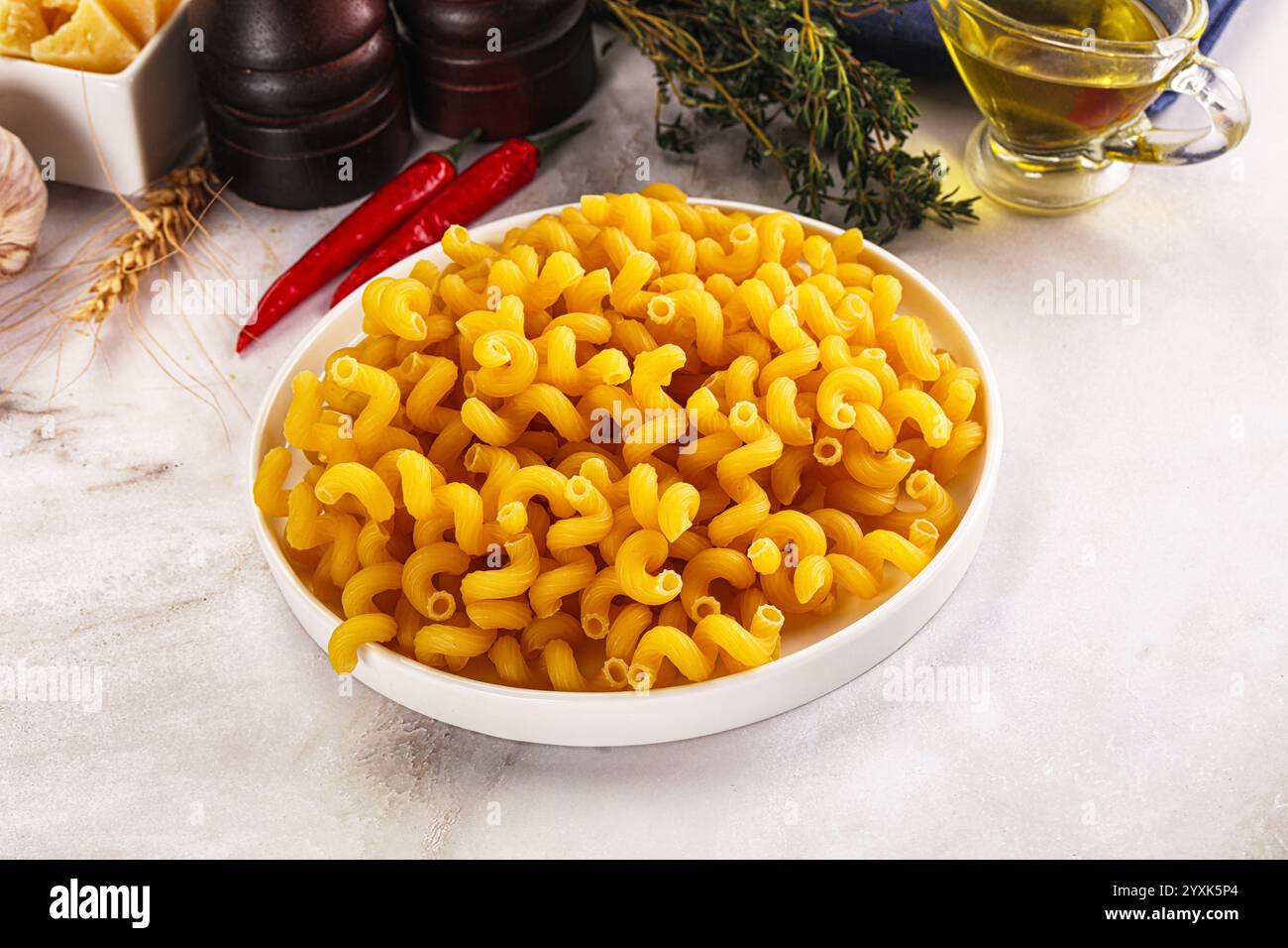 Italian cuisine - dry cellentani pasta for cooking Stock Photo - Alamy