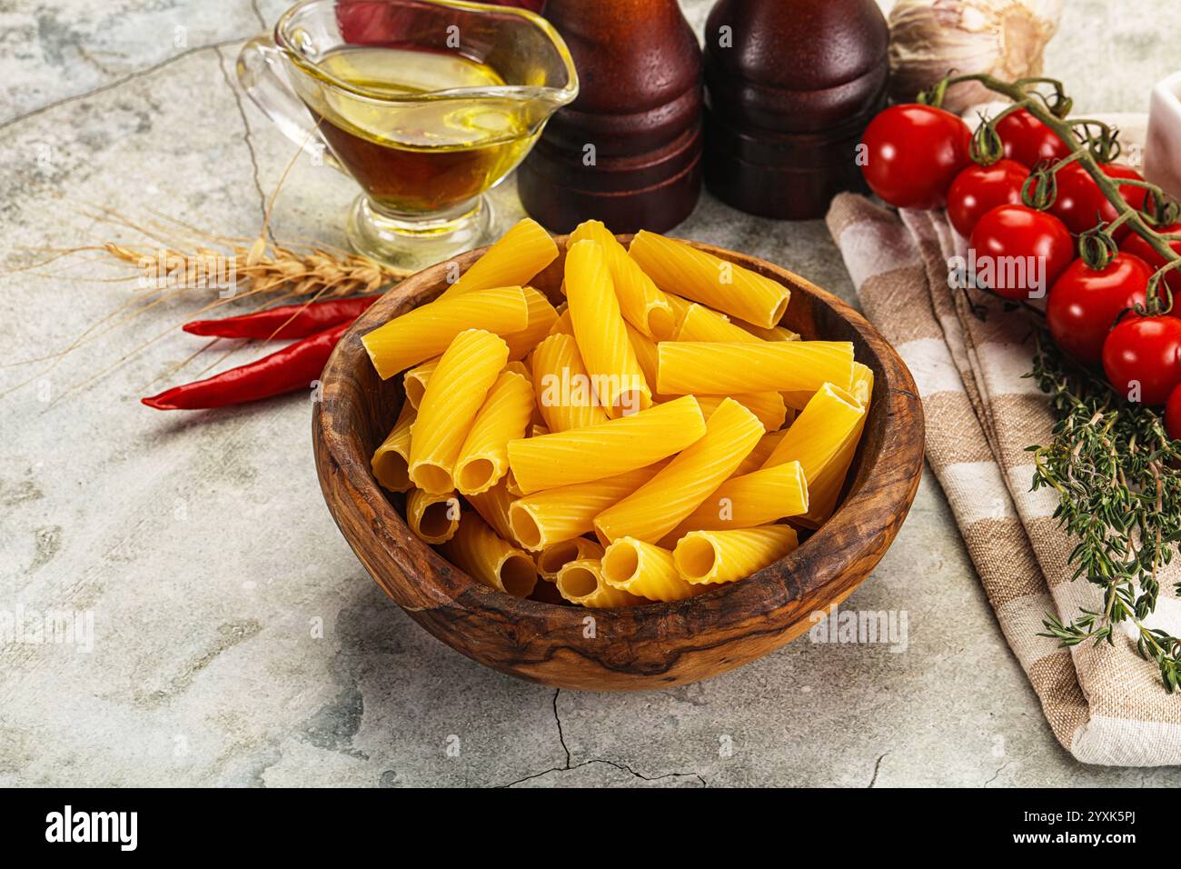 Italian cuisine - raw dry tortiglioni pasta Stock Photo - Alamy