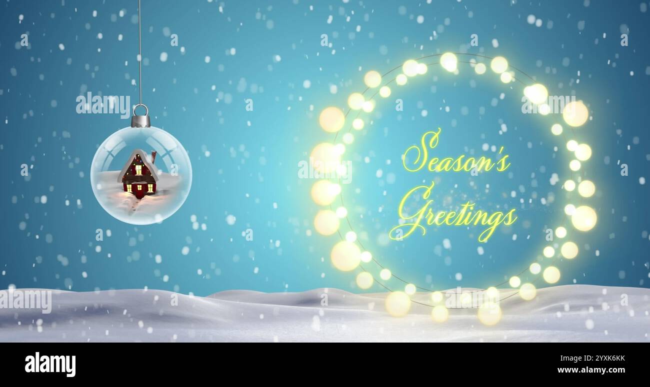 Image of snow falling over hanging snowball and seasons greetings text ...