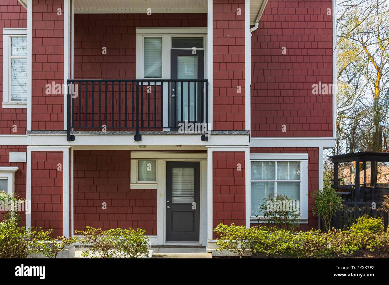 Exterior view of two story red color brick town house . Town home with ...