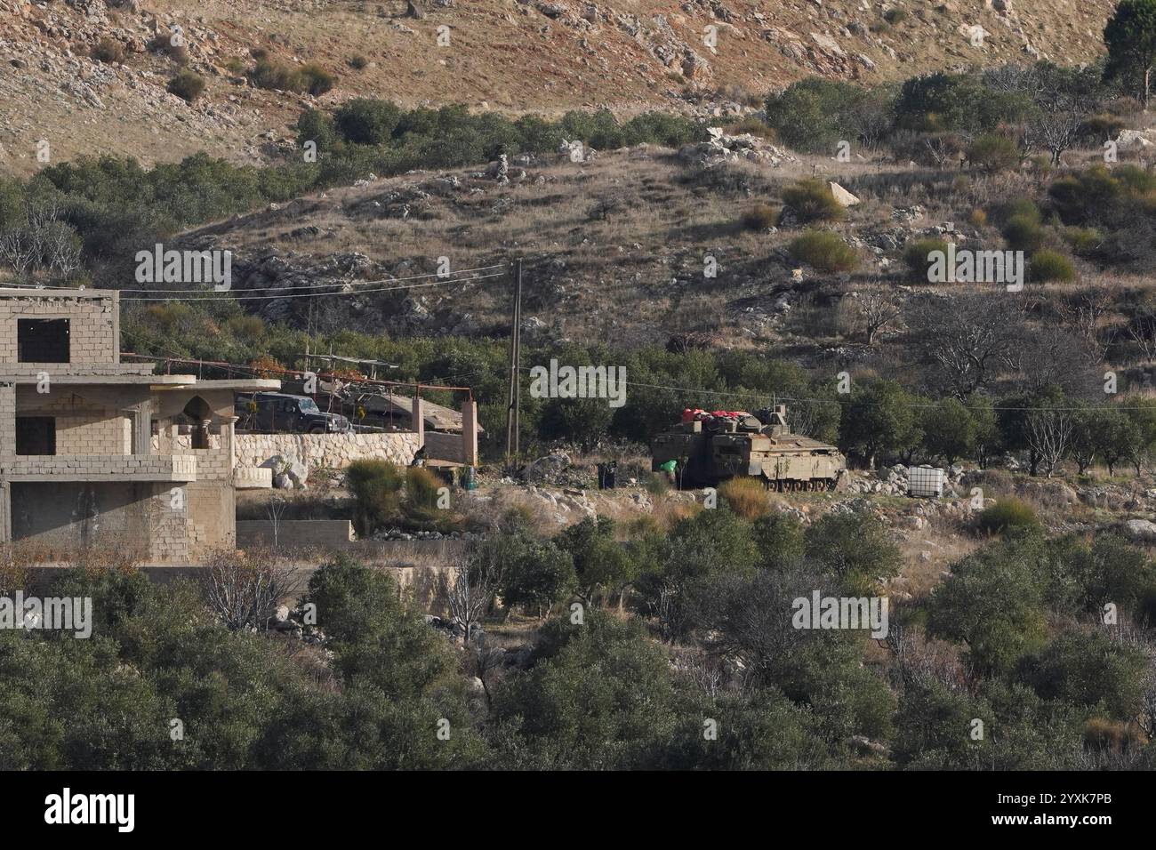Israeli armoured vehicles park inside the buffer zone near the so ...