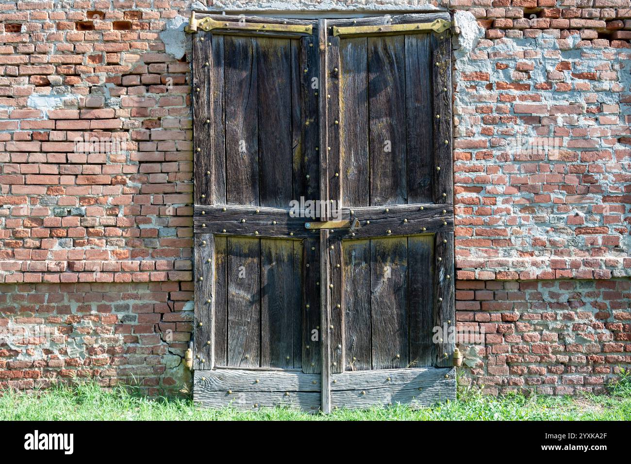 Old brick house wall with old wooden door Stock Photo - Alamy