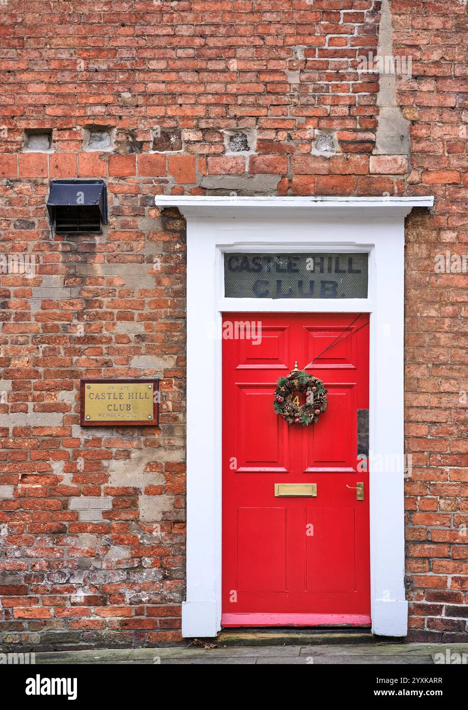 Advent wreath on a red door at 22 Minster Court, Lincoln, England Stock ...