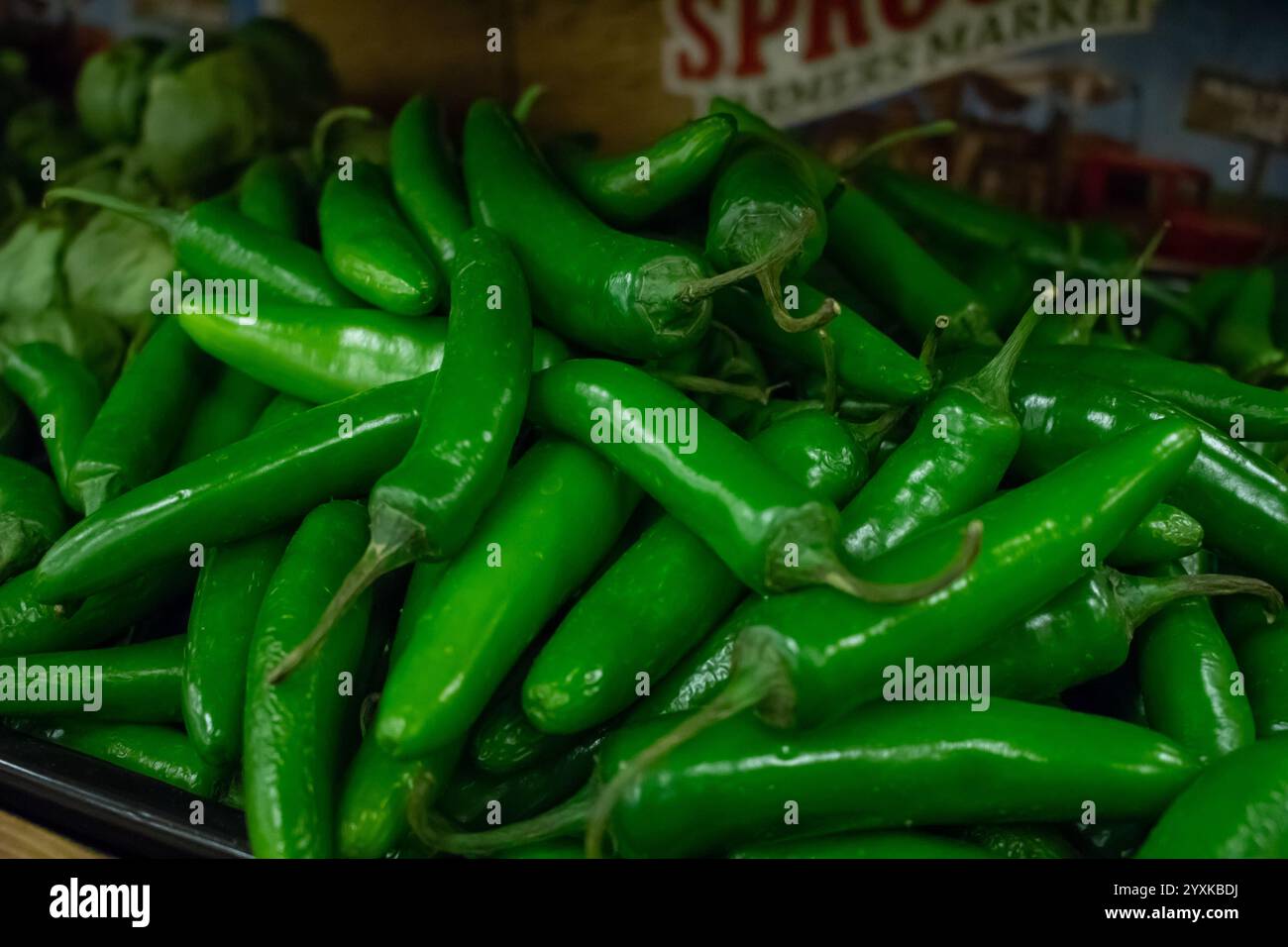 A view of a pile of jalapenos, on display at a local grocery store ...