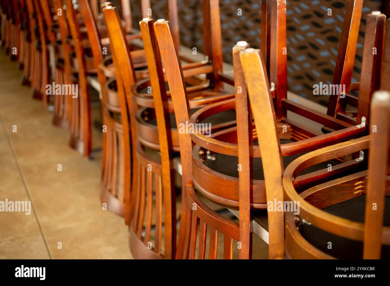 A view inside a closed restaurant dining room, featuring a line of ...