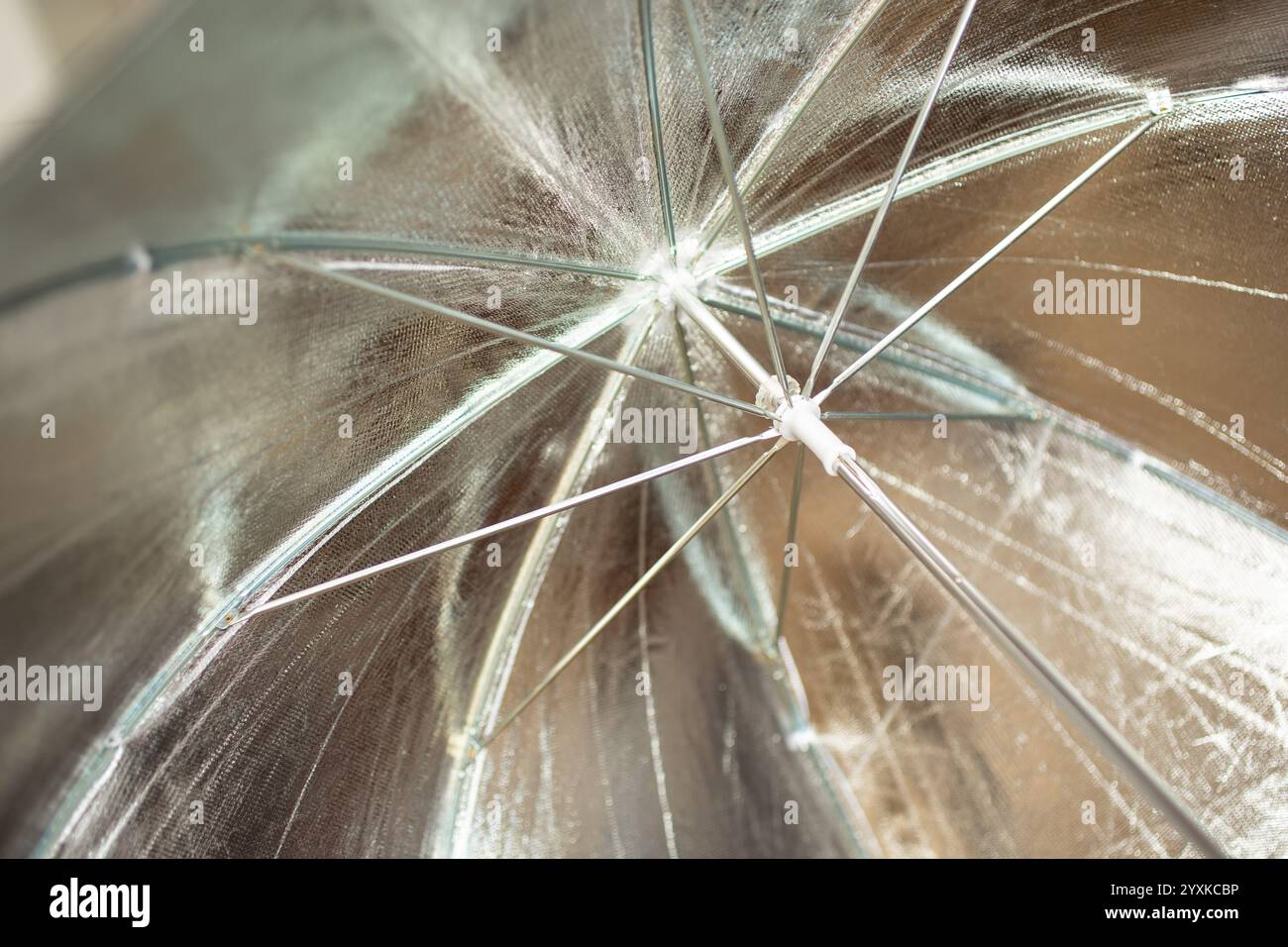 A view of the reflective silver surface of a camera umbrella Stock ...