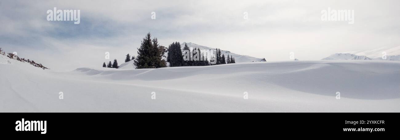 Snow-covered clean slopes in the winter mountains of Central Asia ...
