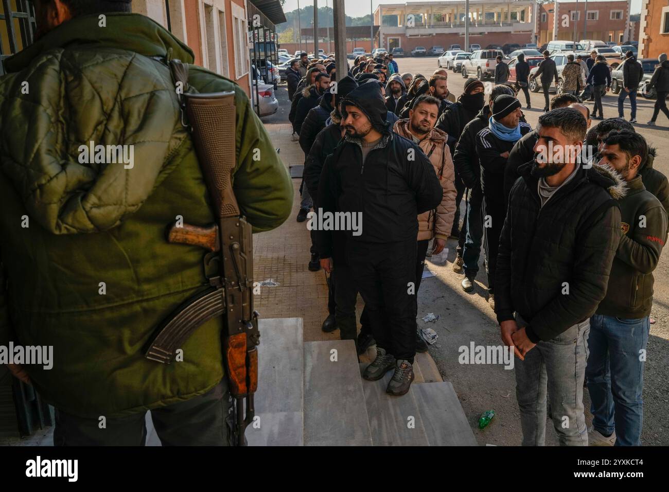 Members from Bashar Assad's Syrian army period line up to register with ...