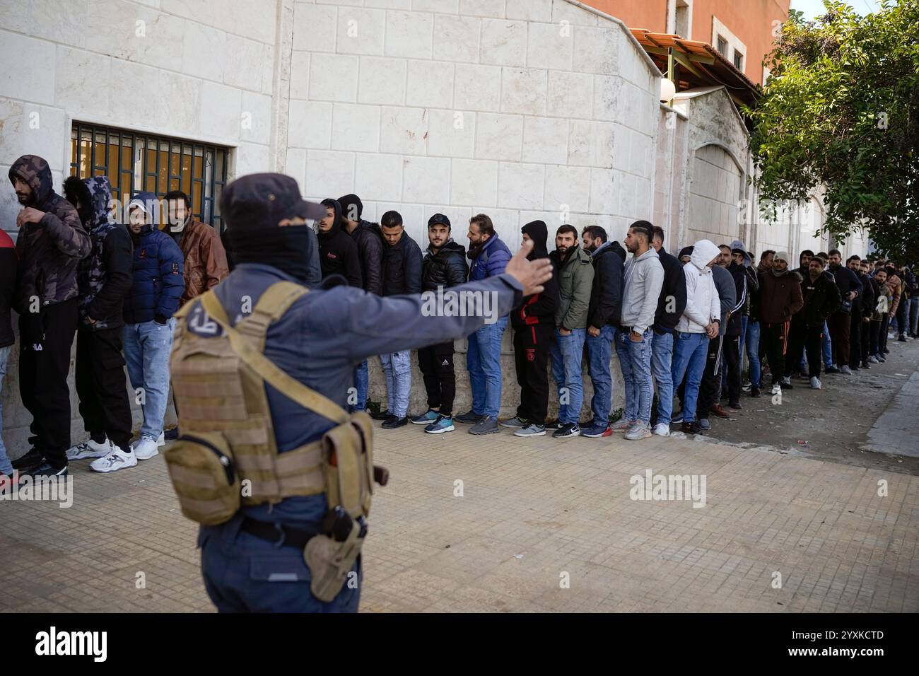 Members from Bashar Assad's Syrian army period line up to register with ...