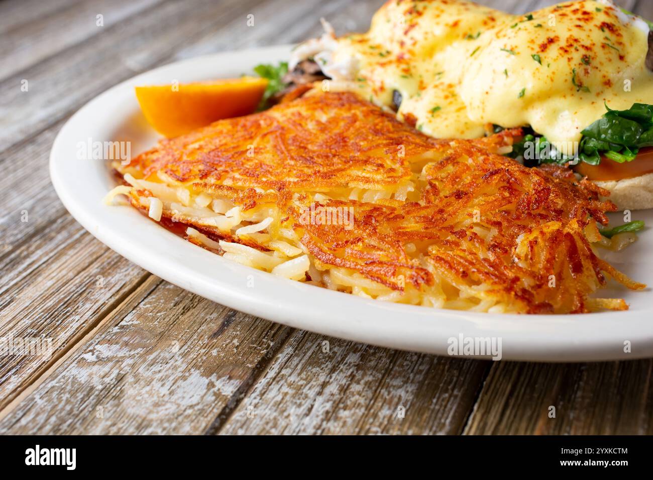 A view of a side portion of shredded hash browns, part of a breakfast ...