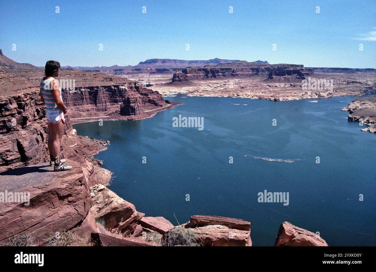 Hiker looking at Lake Powell on Colorado River, high water level in ...