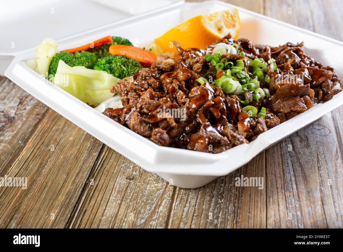 A view of a to-go container of teriyaki beef combination plate Stock ...