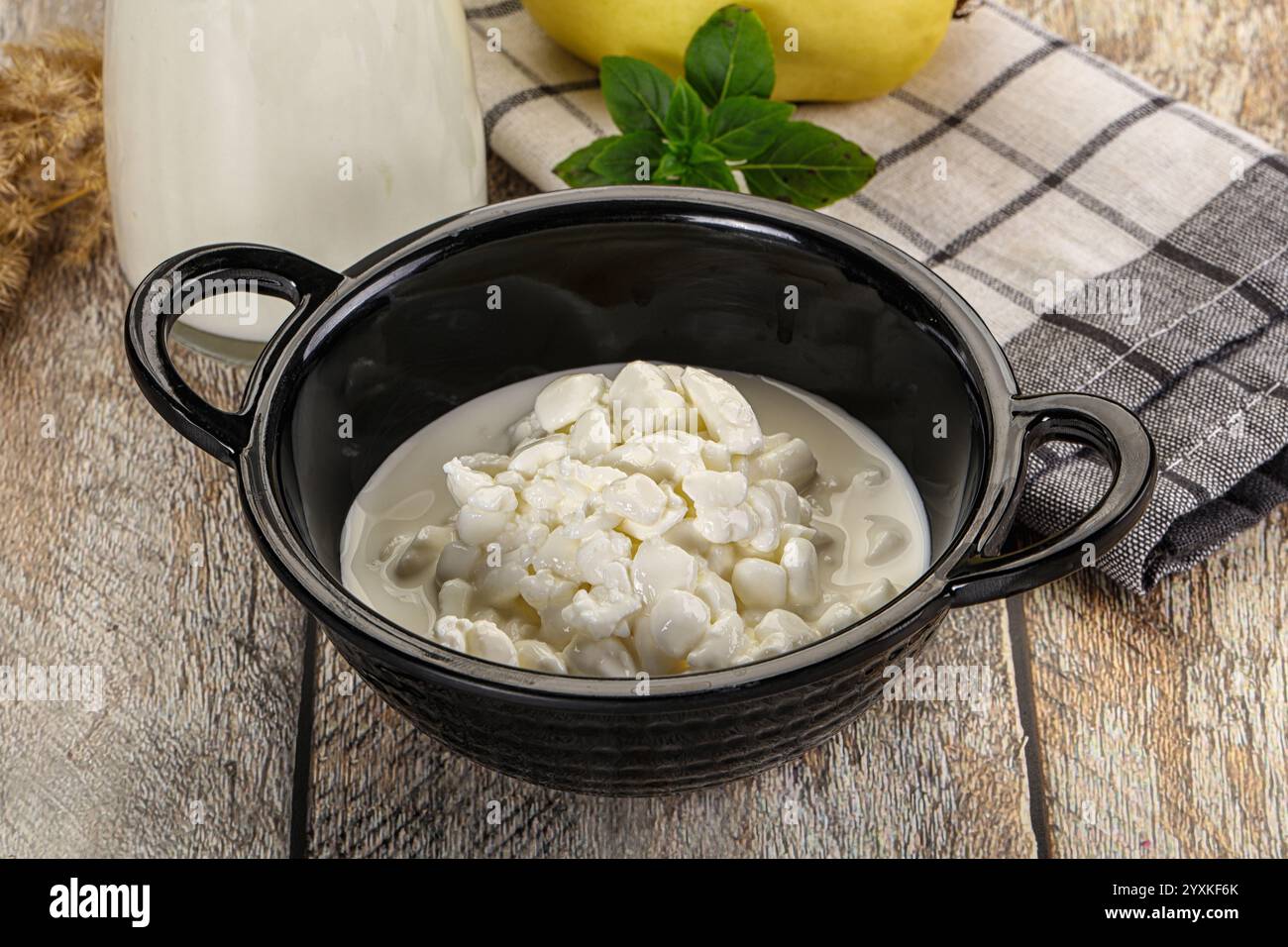 Grain cottage cheese with sour in the bowl Stock Photo - Alamy