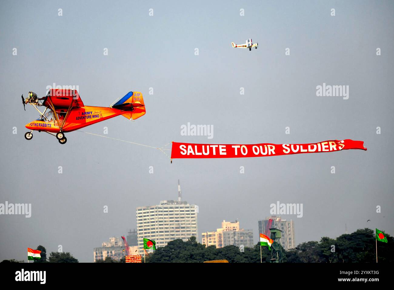 Kolkata, India. 16th Dec, 2024. A plane flies with a giant banner that ...