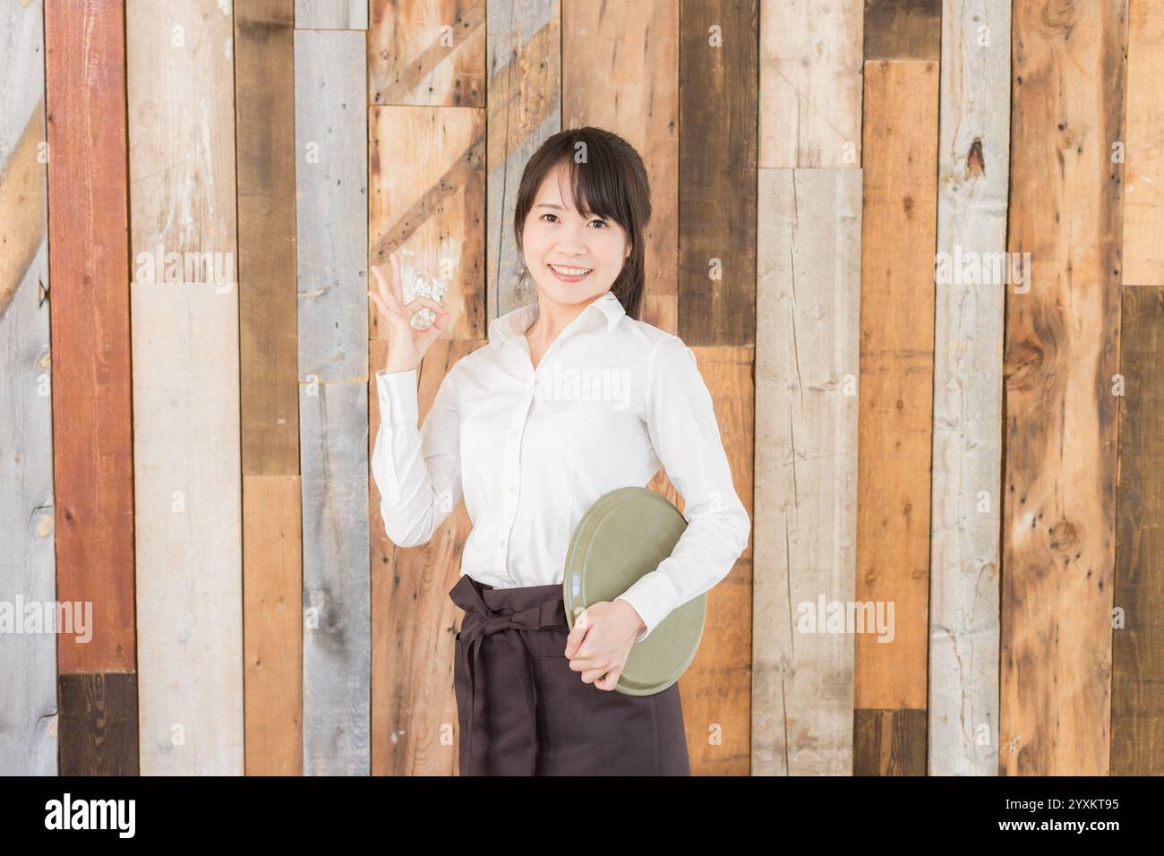 Female staff at the café Stock Photo - Alamy