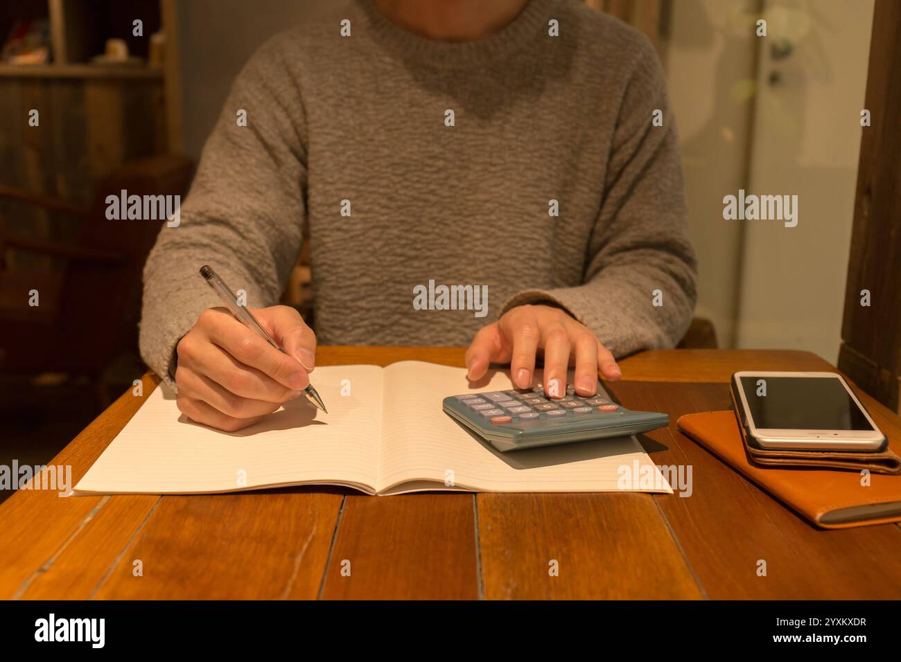 People doing calculations in café Stock Photo - Alamy
