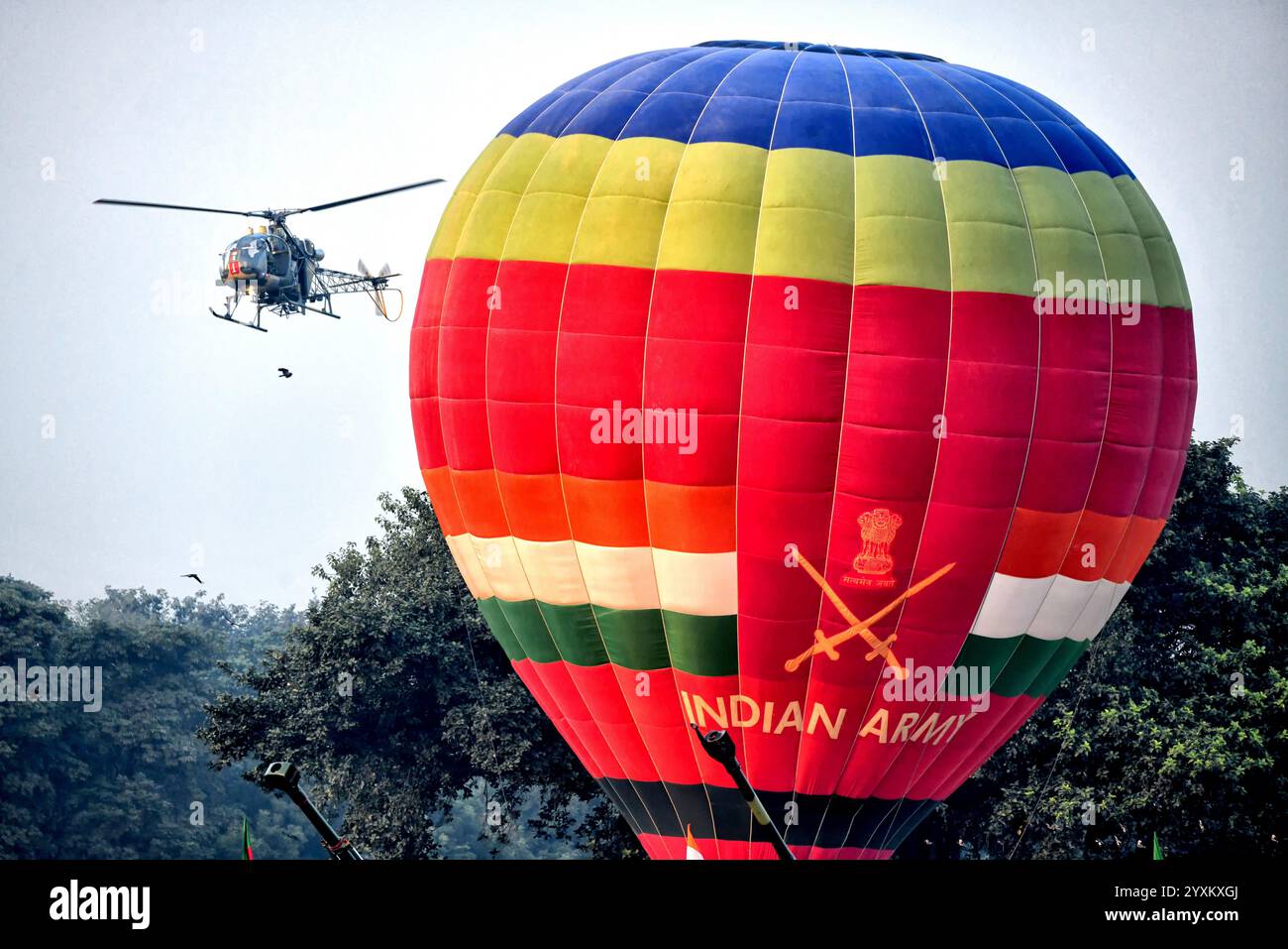 Indian army soldiers demonstrate their skills with a helicopter and Air ...