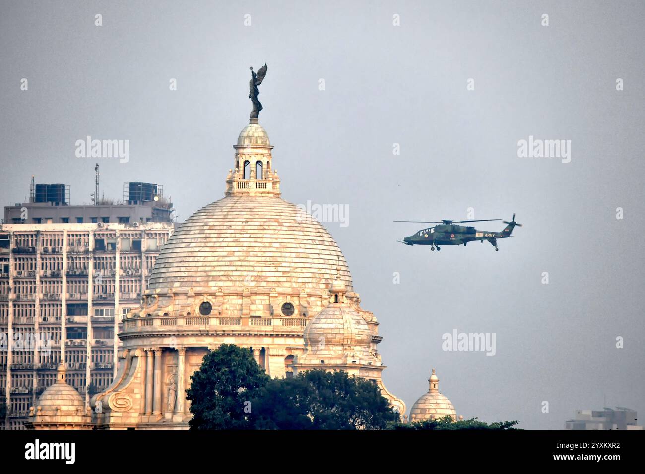 Indian army soldiers demonstrate their skills with a helicopter during ...