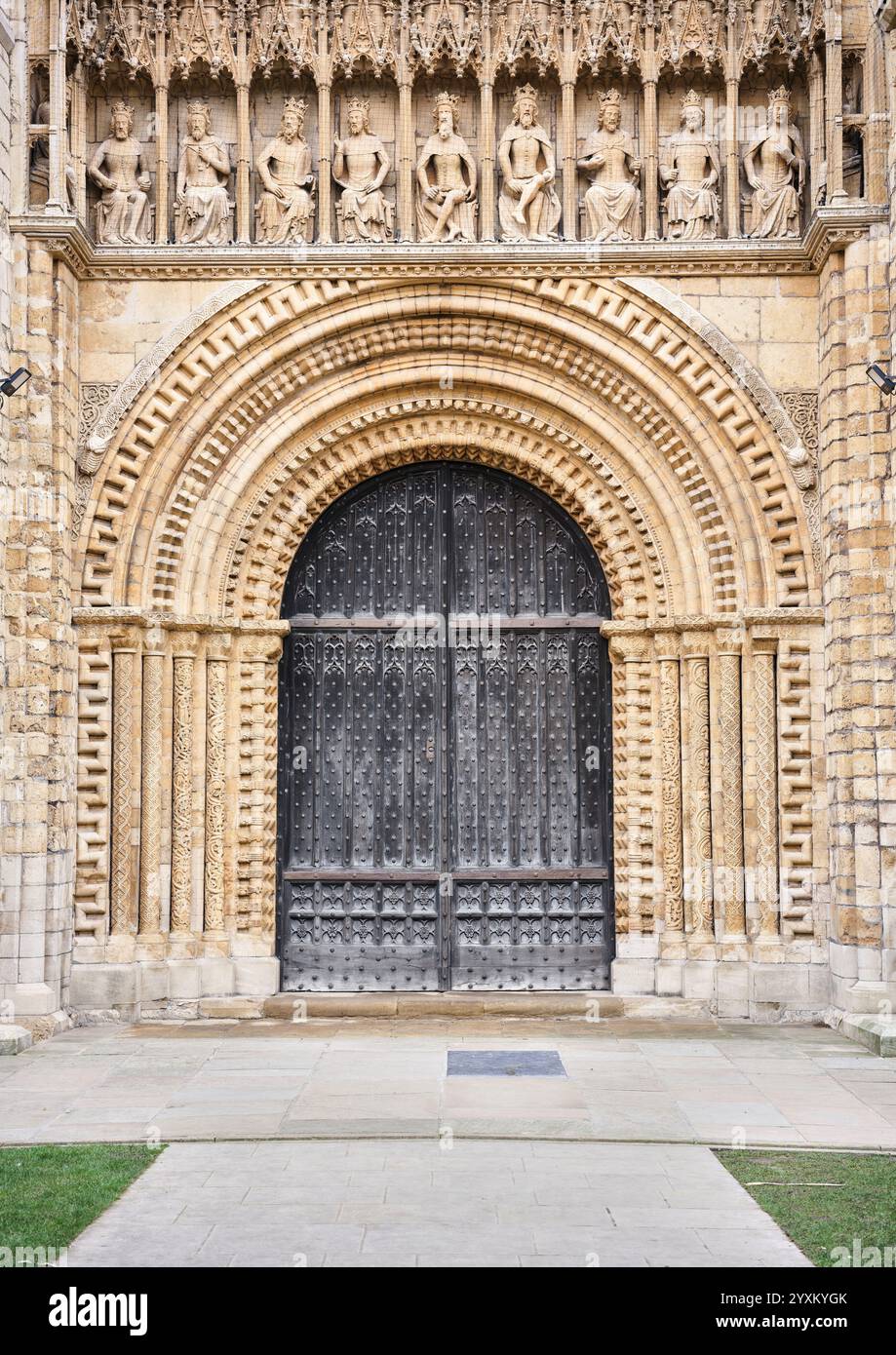 Row of statues (of english kings) above a decorated oak door at the ...