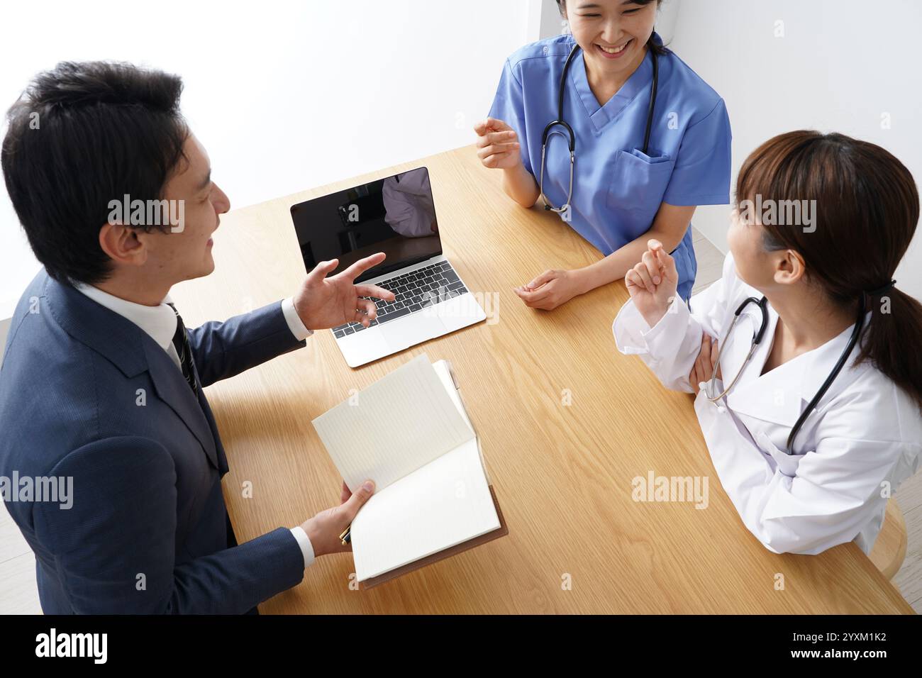 Female doctors and male reps Stock Photo - Alamy