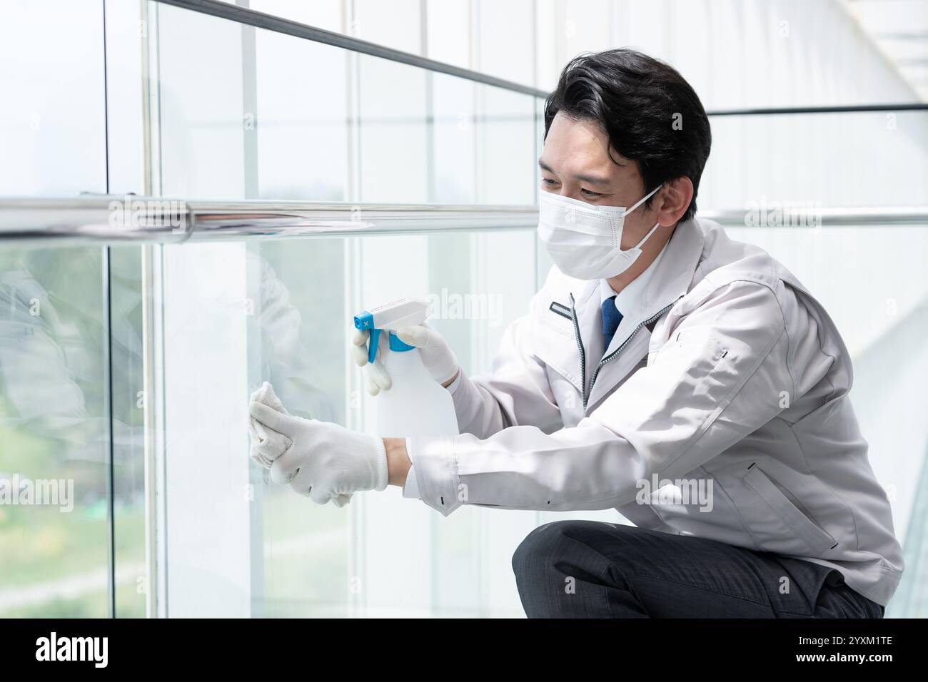 Male workers cleaning up Stock Photo - Alamy