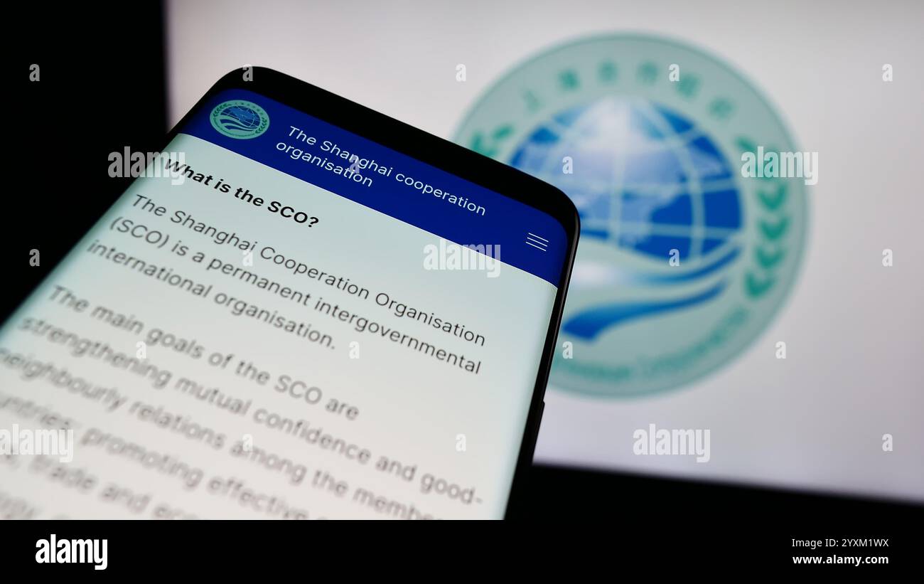 In this photo illustration, a mobile phone with the website of Eurasian ...