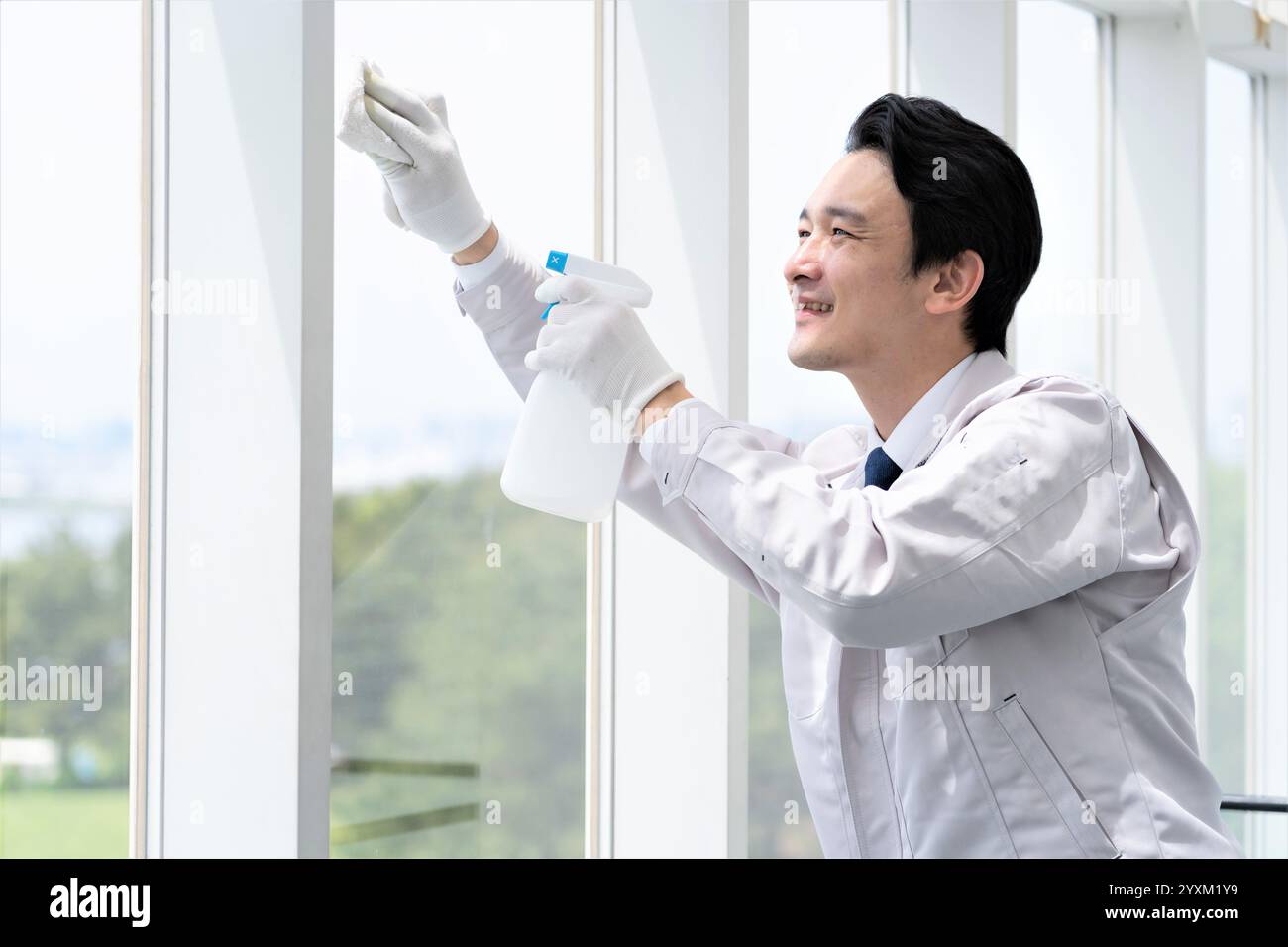Male workers cleaning up Stock Photo - Alamy