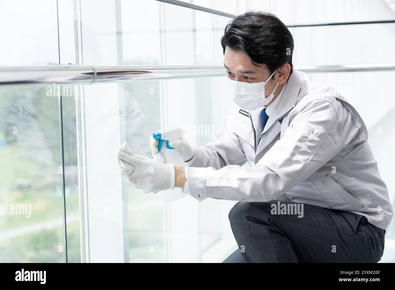 Male workers cleaning up Stock Photo - Alamy