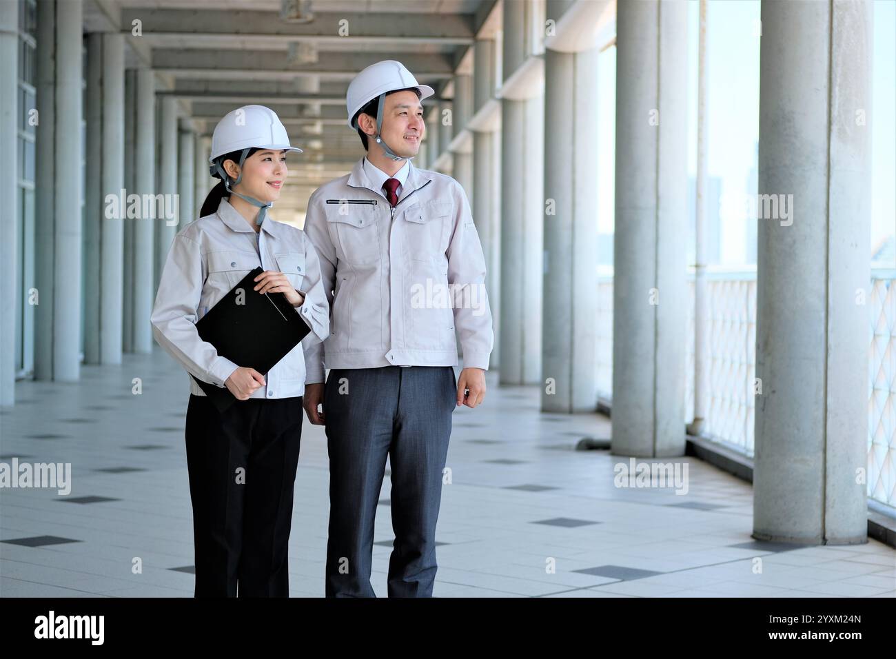 Male and female workers Stock Photo - Alamy