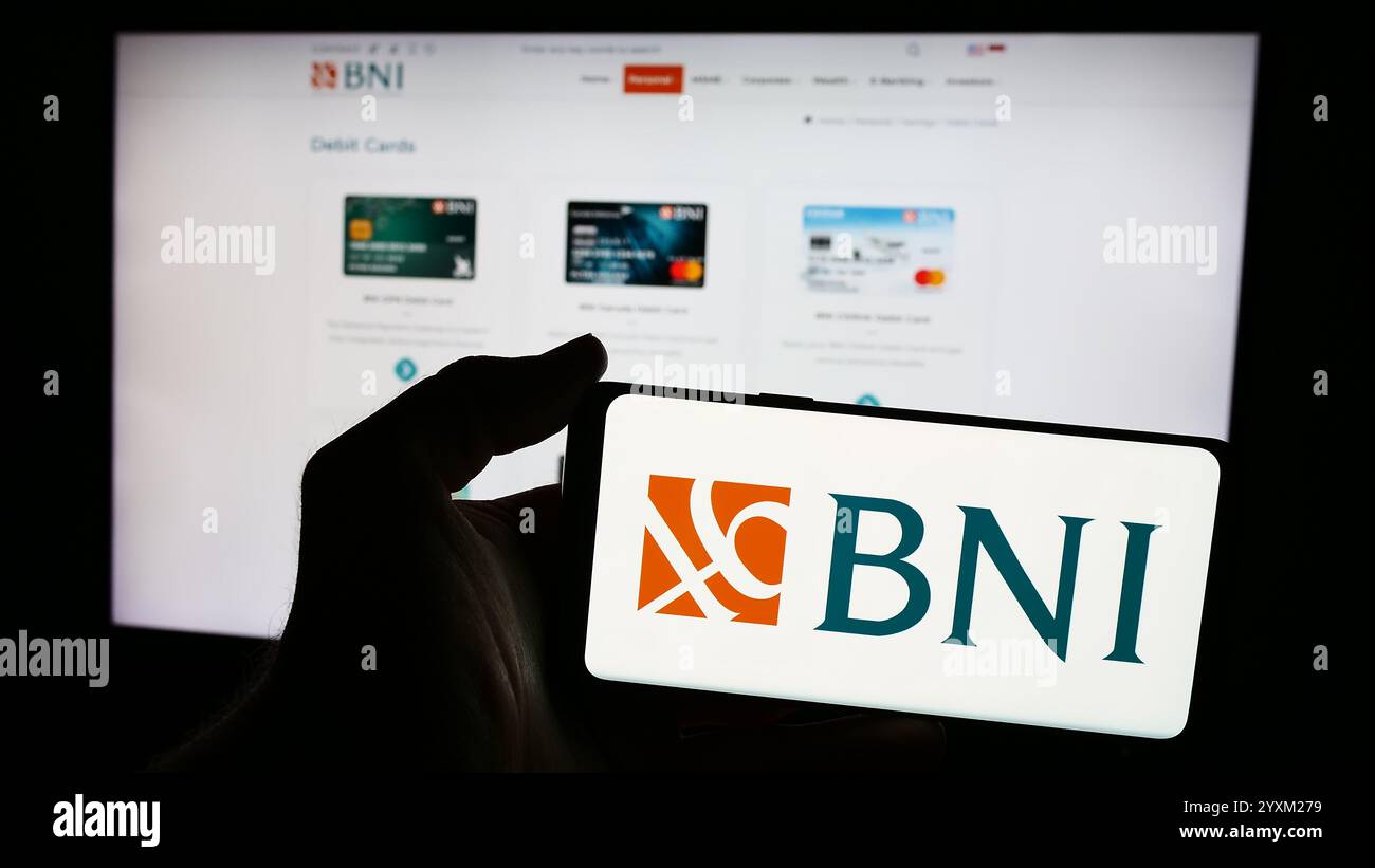 In this photo illustration, a person is holding a smartphone with the ...