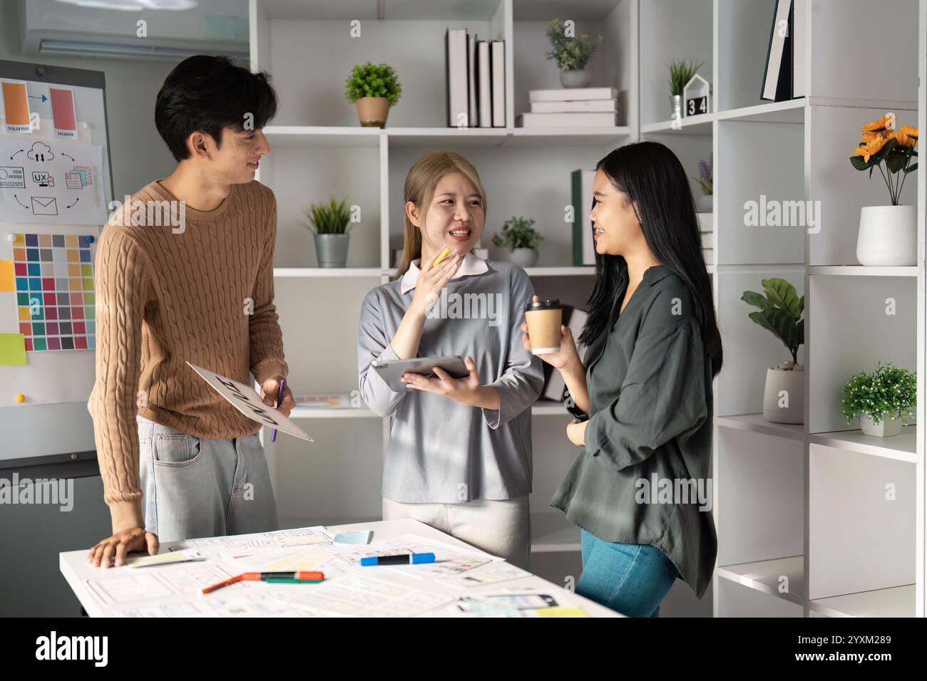 Creative Team Collaborating On Ux Ui Design Project In Modern Office