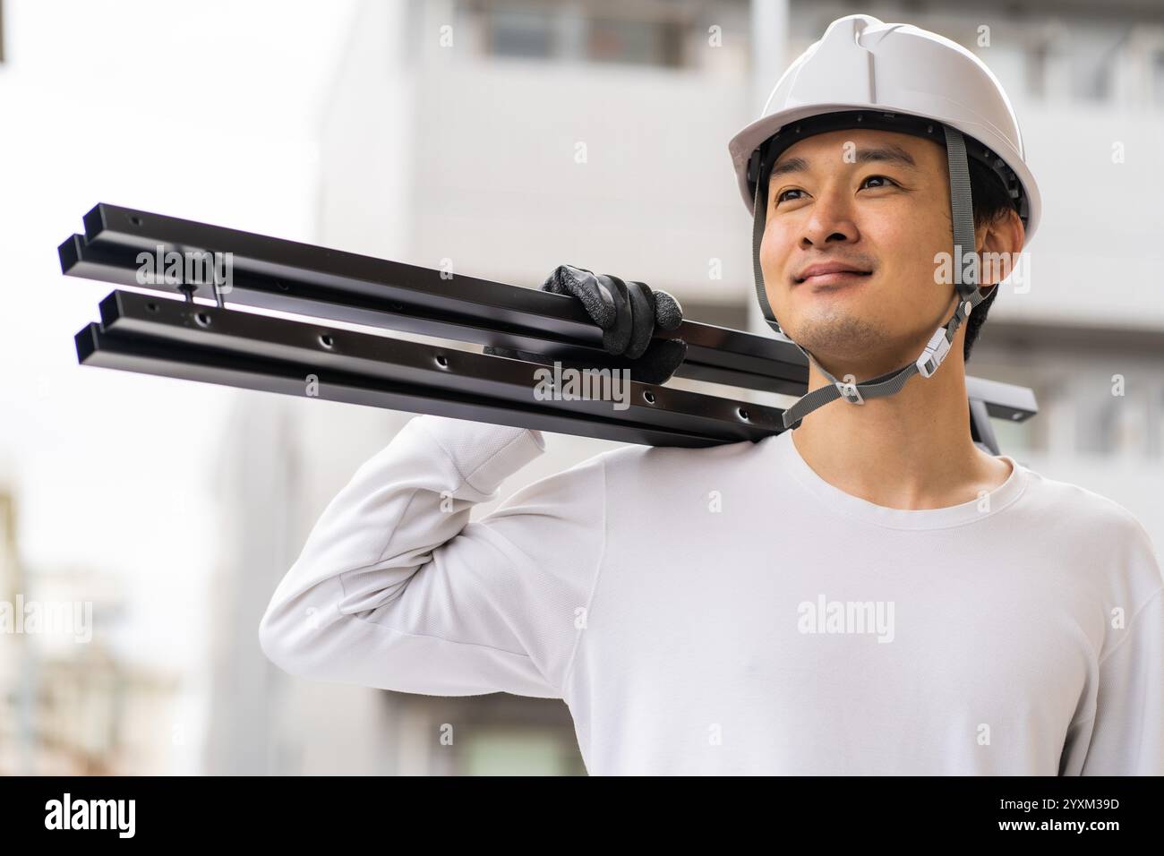 Male worker with building materials Stock Photo - Alamy
