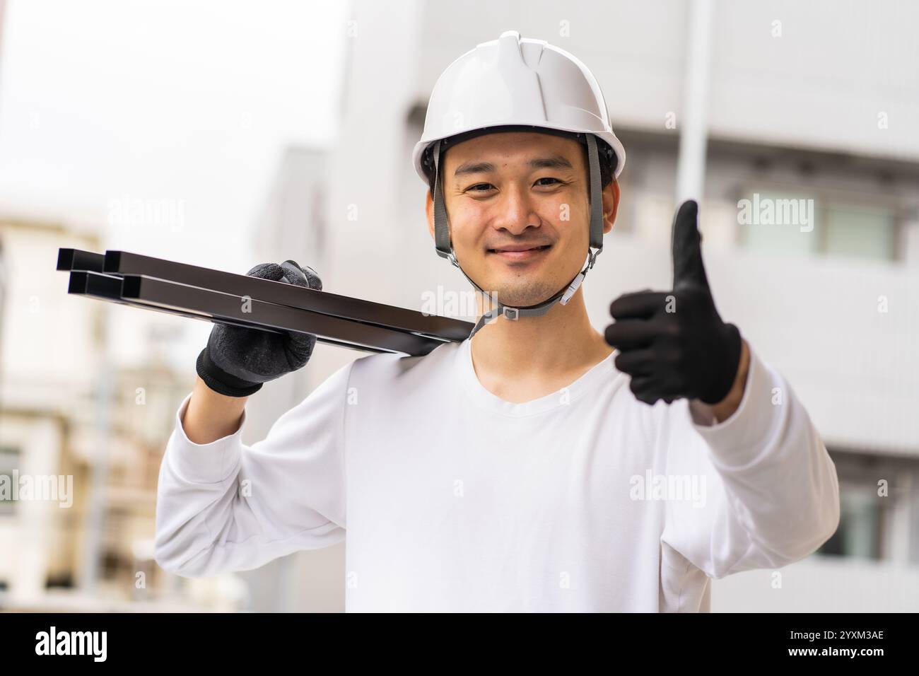 Male worker with building materials Stock Photo - Alamy