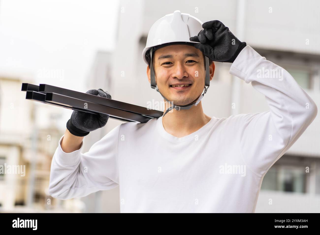 Male worker with building materials Stock Photo - Alamy