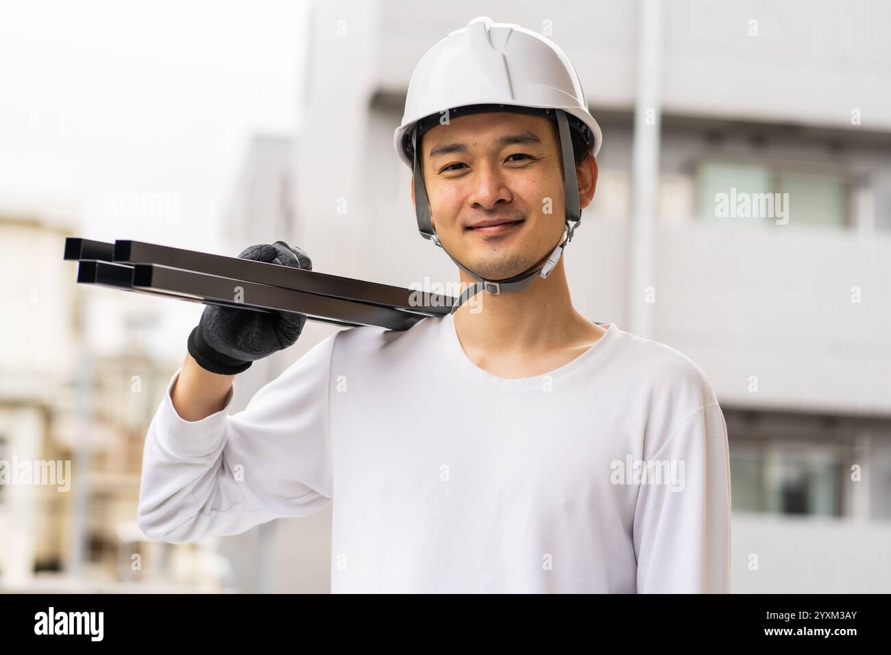 Male worker with building materials Stock Photo - Alamy