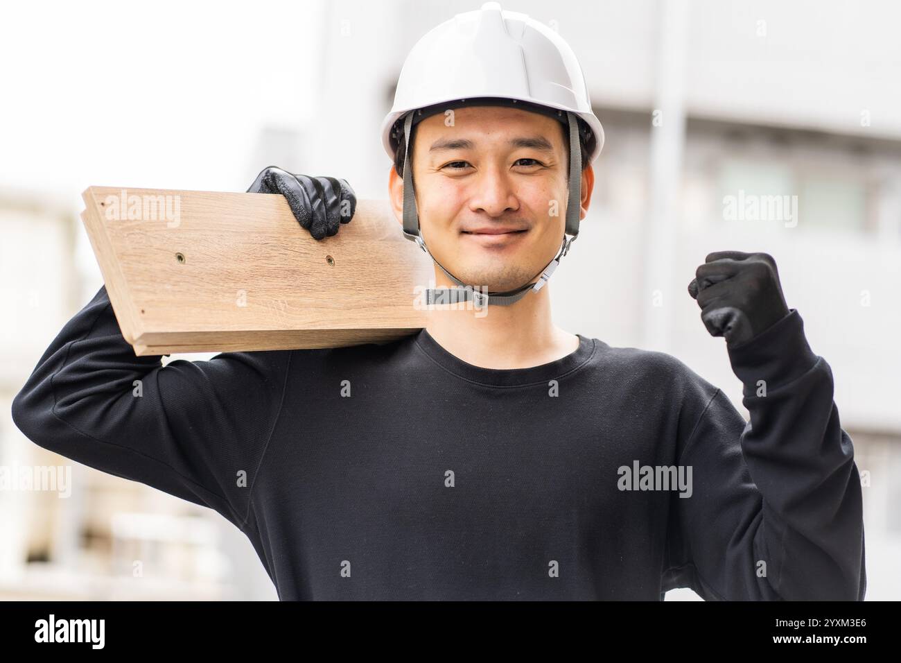 Male worker with building materials Stock Photo - Alamy