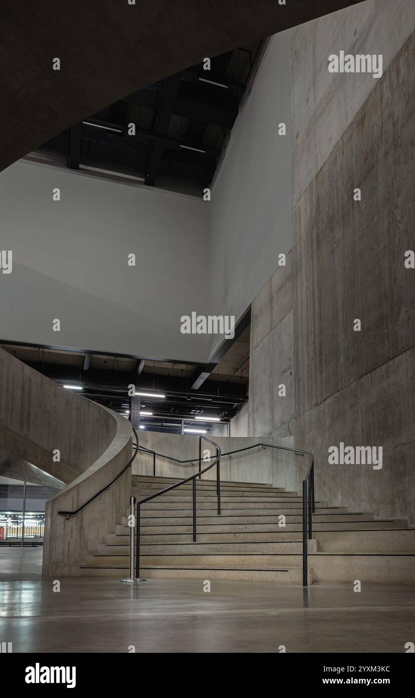 London, UK - Nov 07, 2023 - A curving flight concrete spiral staircase ...