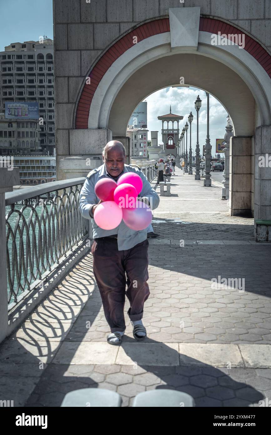 Man walking with balloons hi-res stock photography and images - Alamy